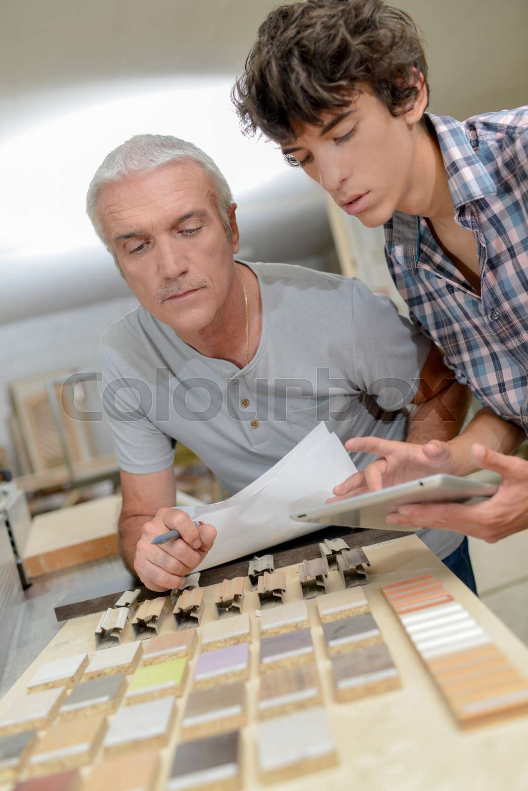 Carpenter choosing colour scheme | Stock image | Colourbox
