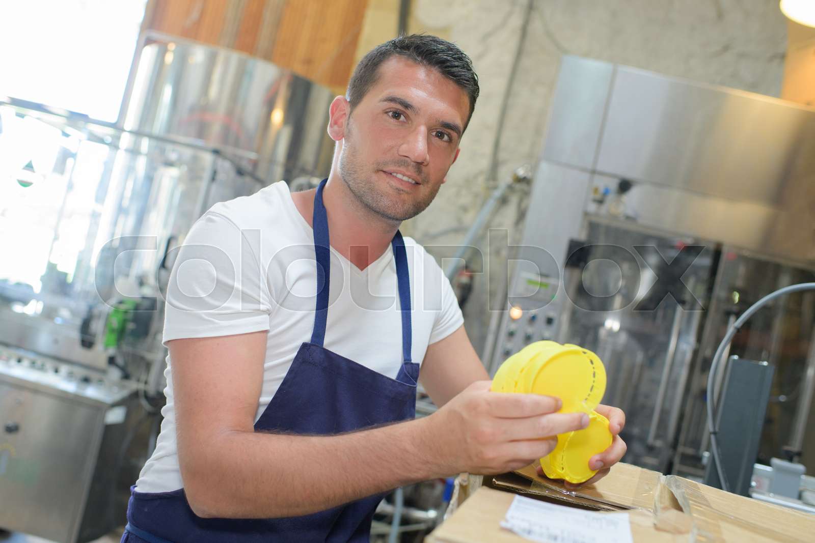 consumption distillery worker posing | Stock image | Colourbox