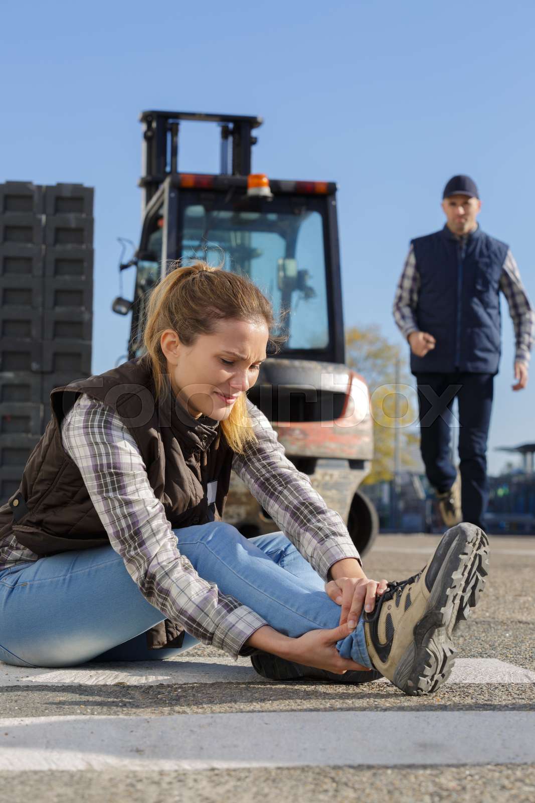 female worker with ankle injury | Stock image | Colourbox