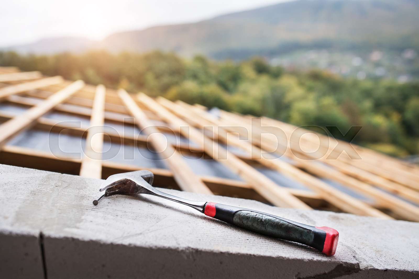 Hammer on the roof on the construction site. | Stock image | Colourbox
