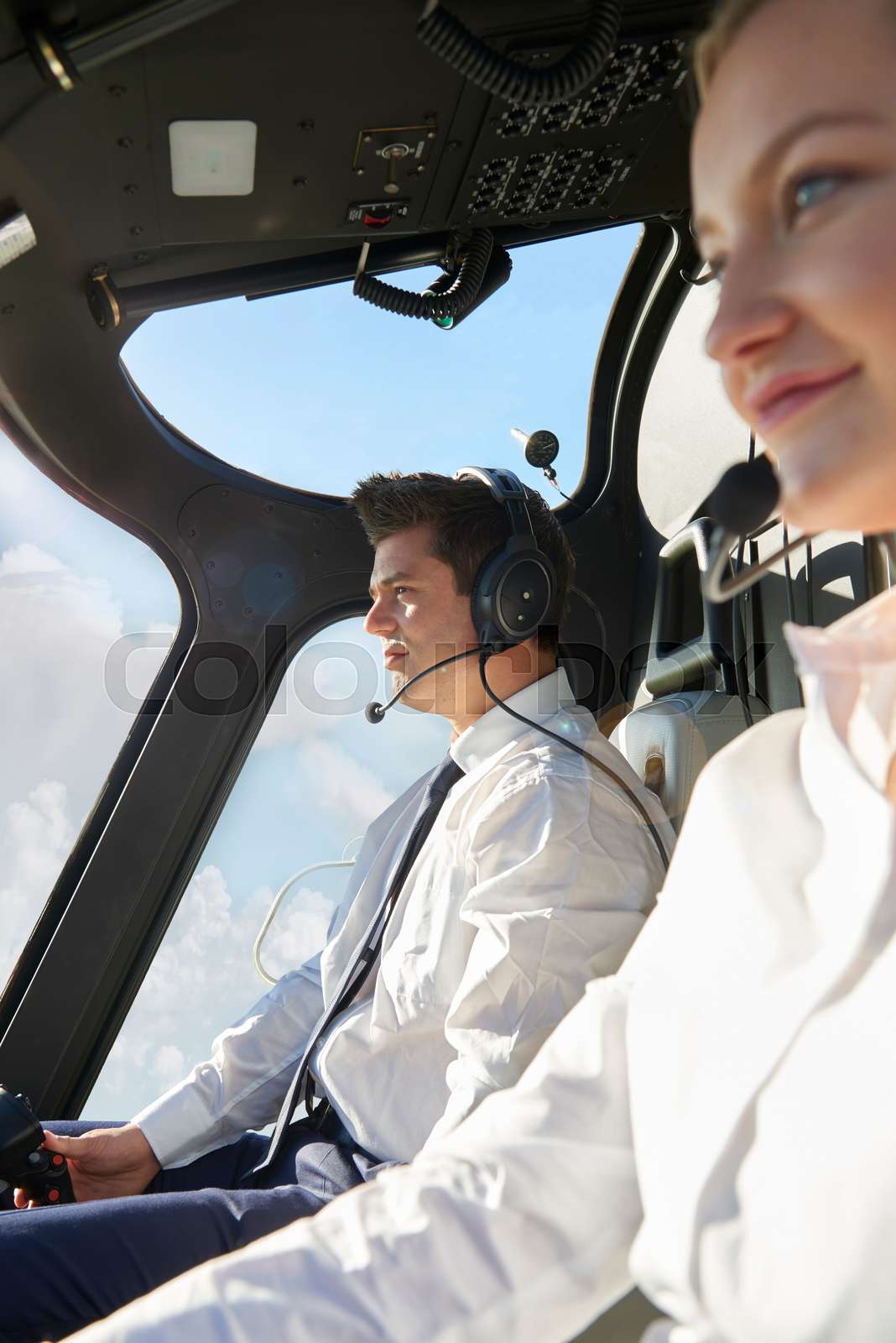 Pilot And Co Pilot In Cockpit Of Helicopter | Stock image | Colourbox
