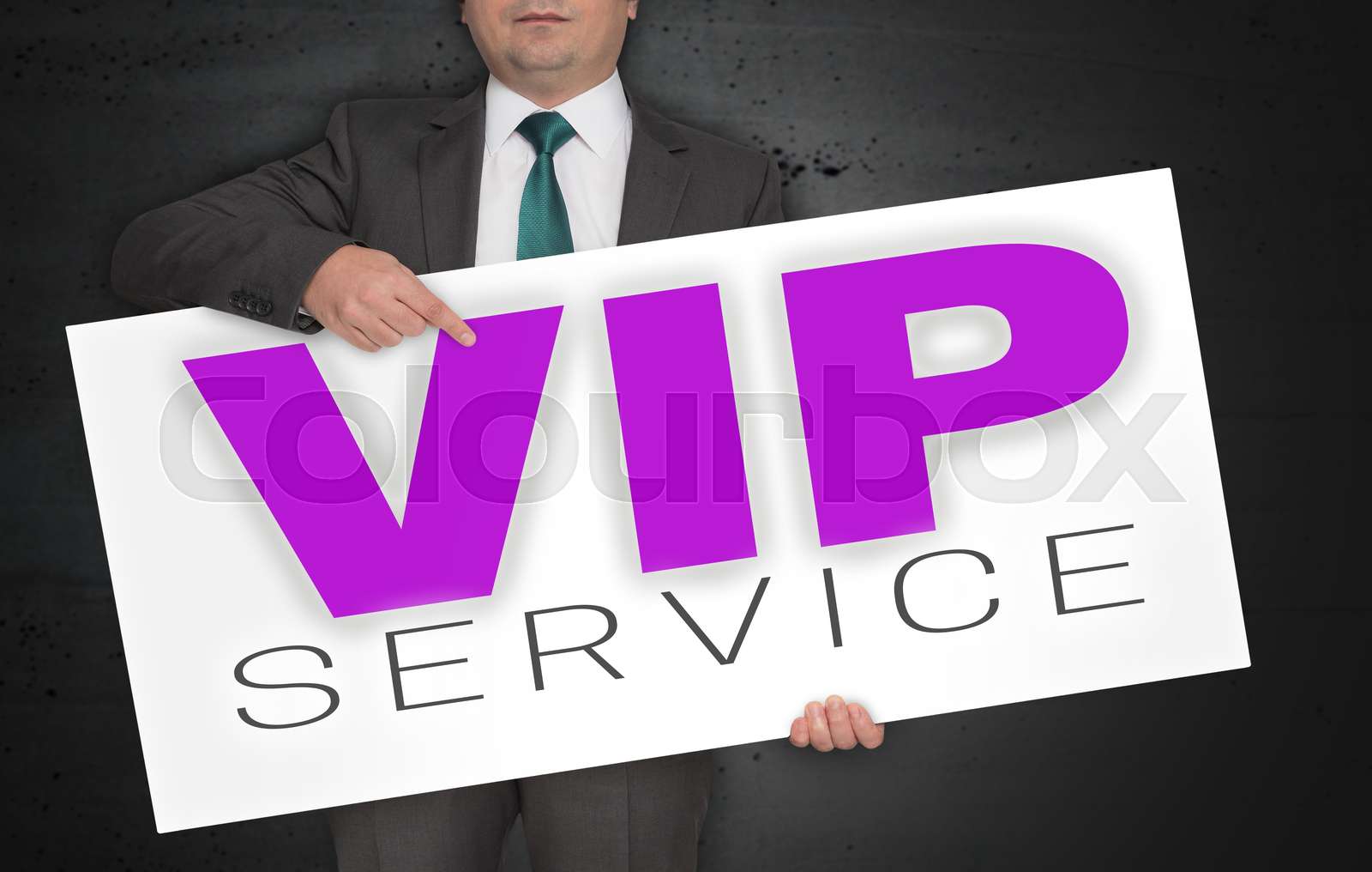 VIP service poster is held by businessman | Stock image | Colourbox