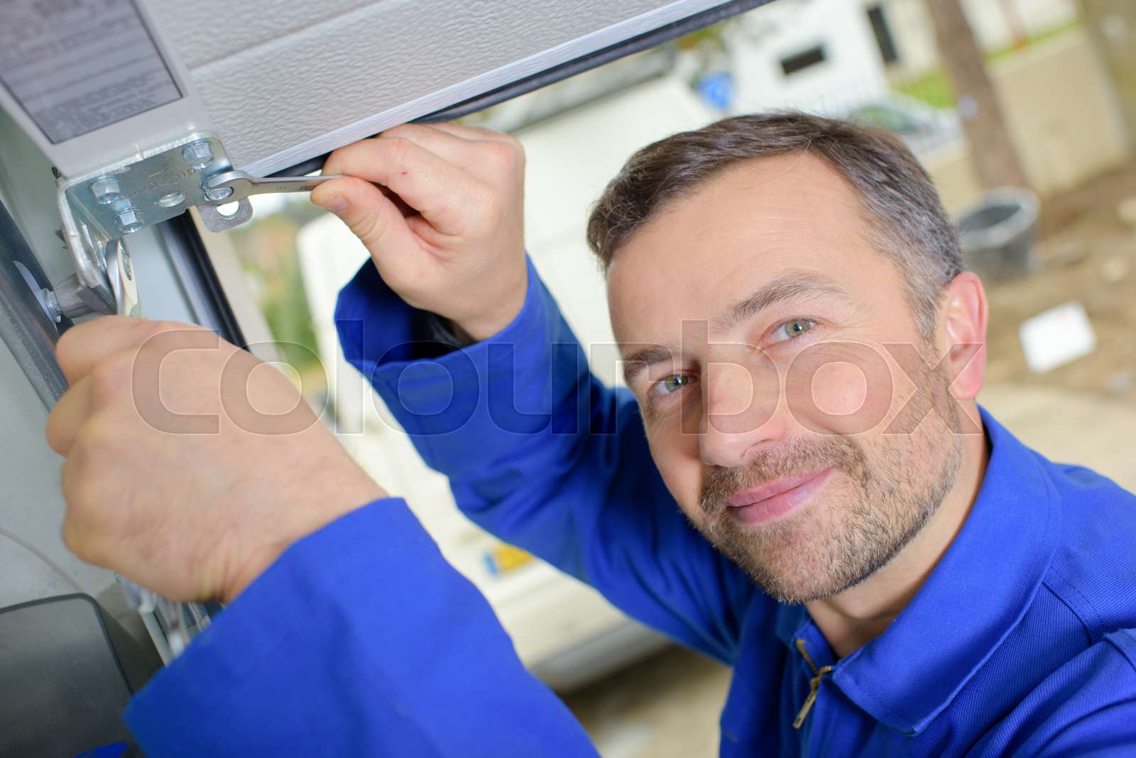 man fixing something | Stock image | Colourbox