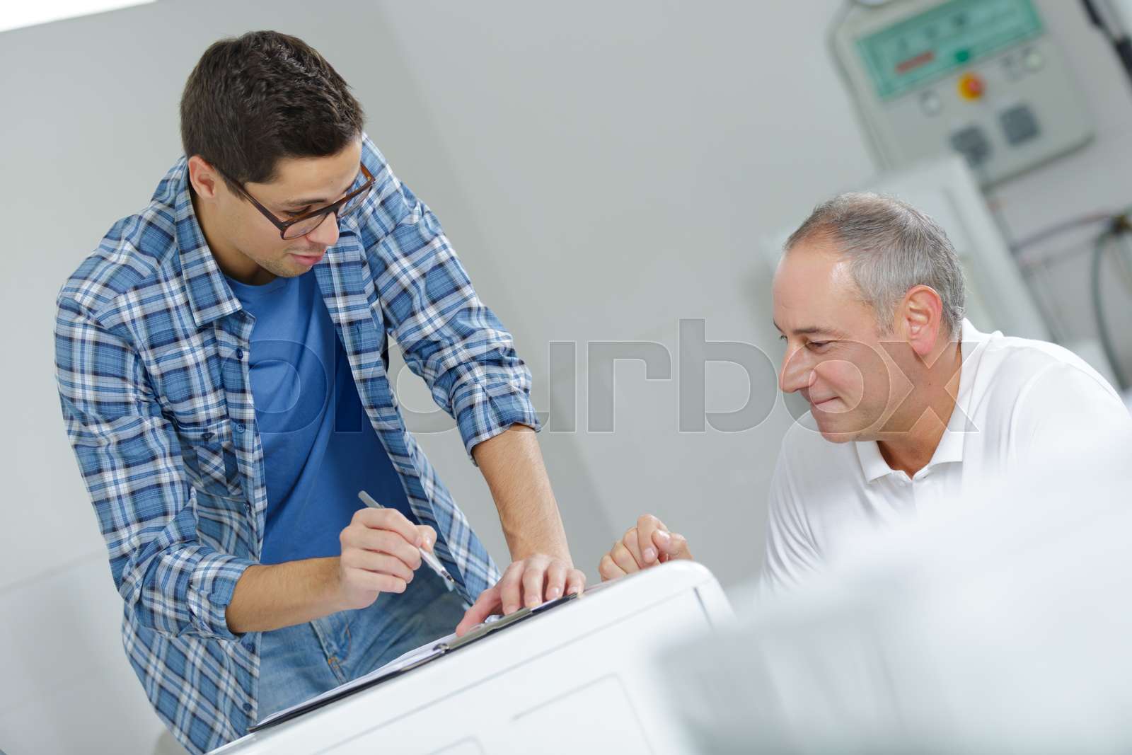 fixing a machine | Stock image | Colourbox