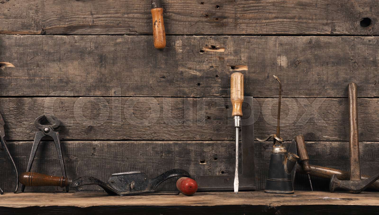 Old used carpenter tools on wood | Stock image | Colourbox