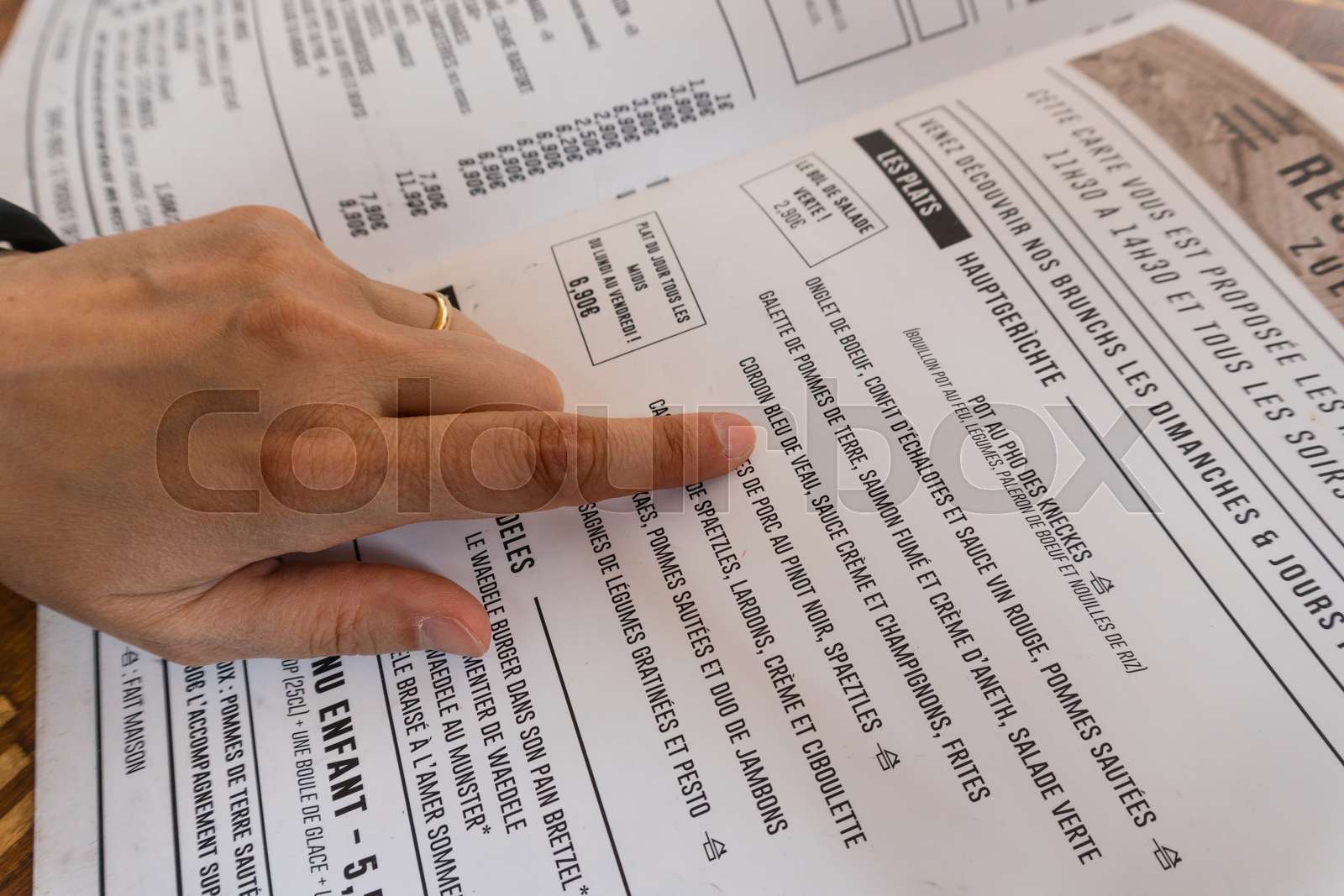 detail of a female hand browsing a menu at the restaurant | Stock image ...