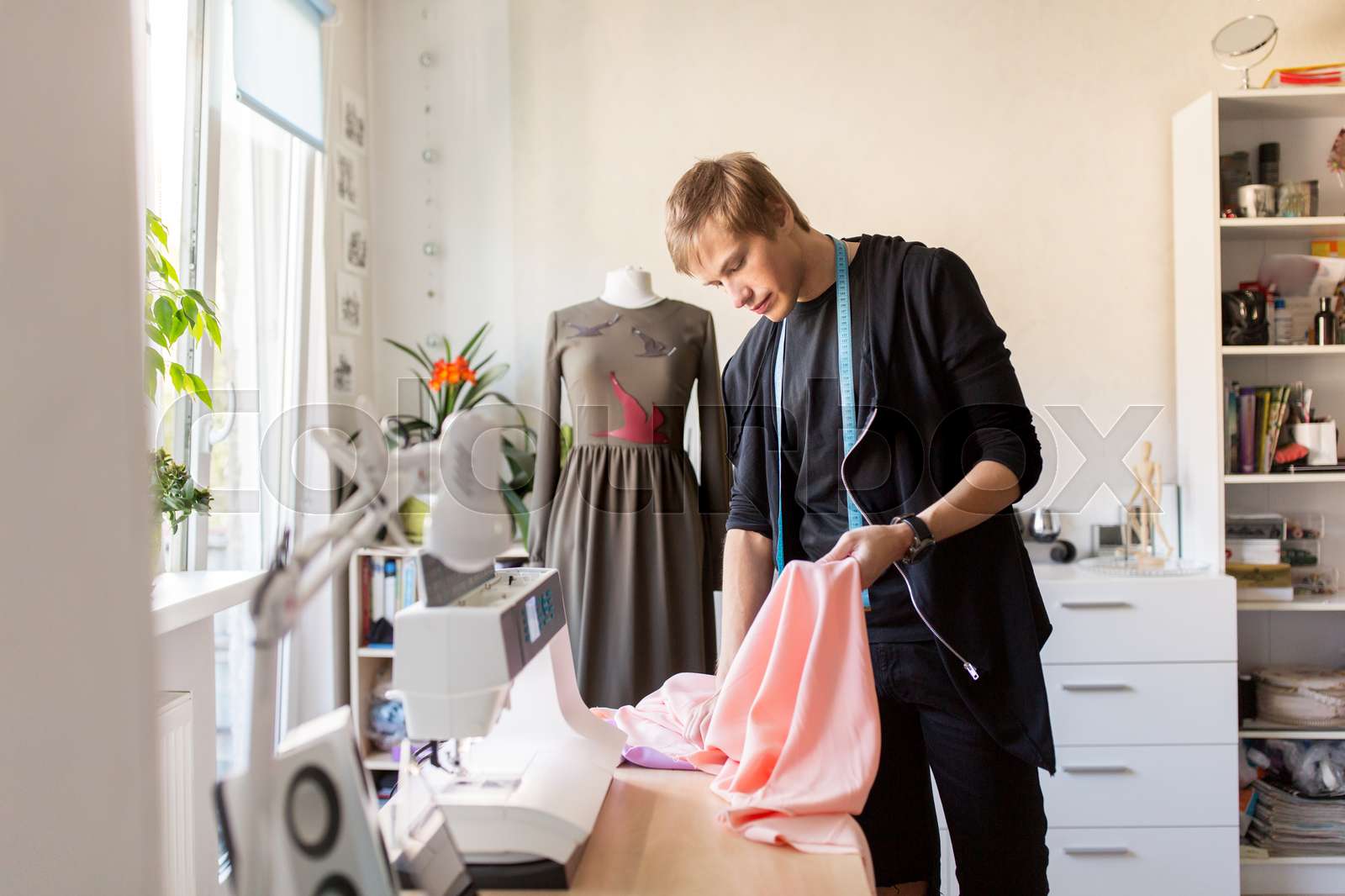 fashion designer with cloth making dress at studio | Stock image ...