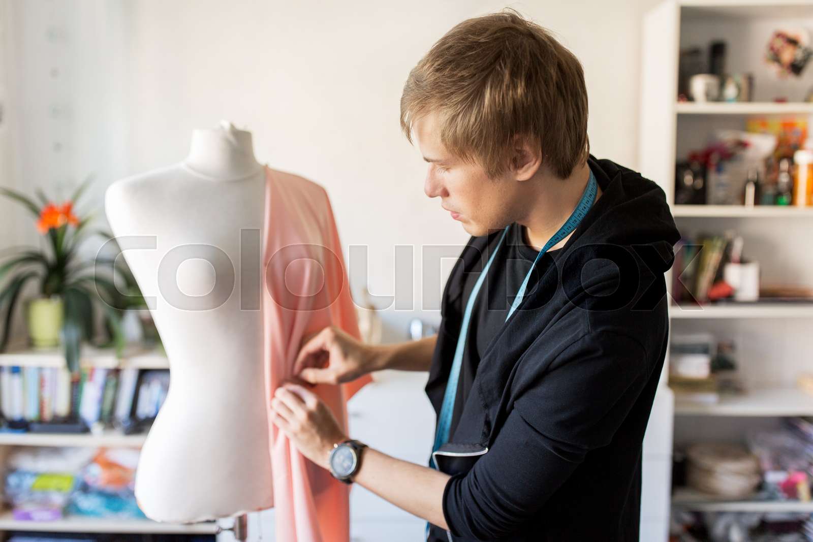 fashion designer with dummy making dress at studio | Stock image ...