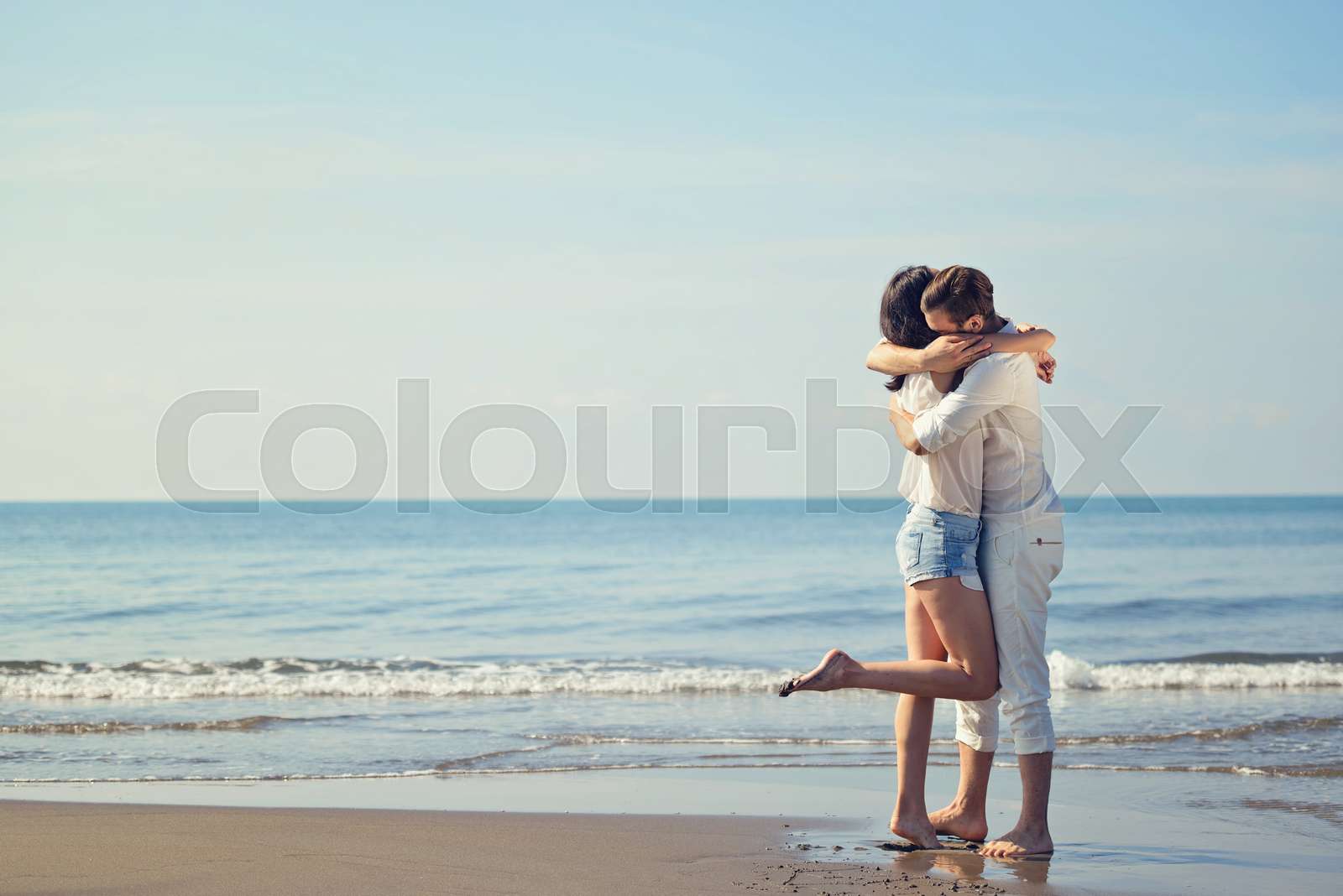 Romantic young couple on the beach kissing. | Stock image | Colourbox