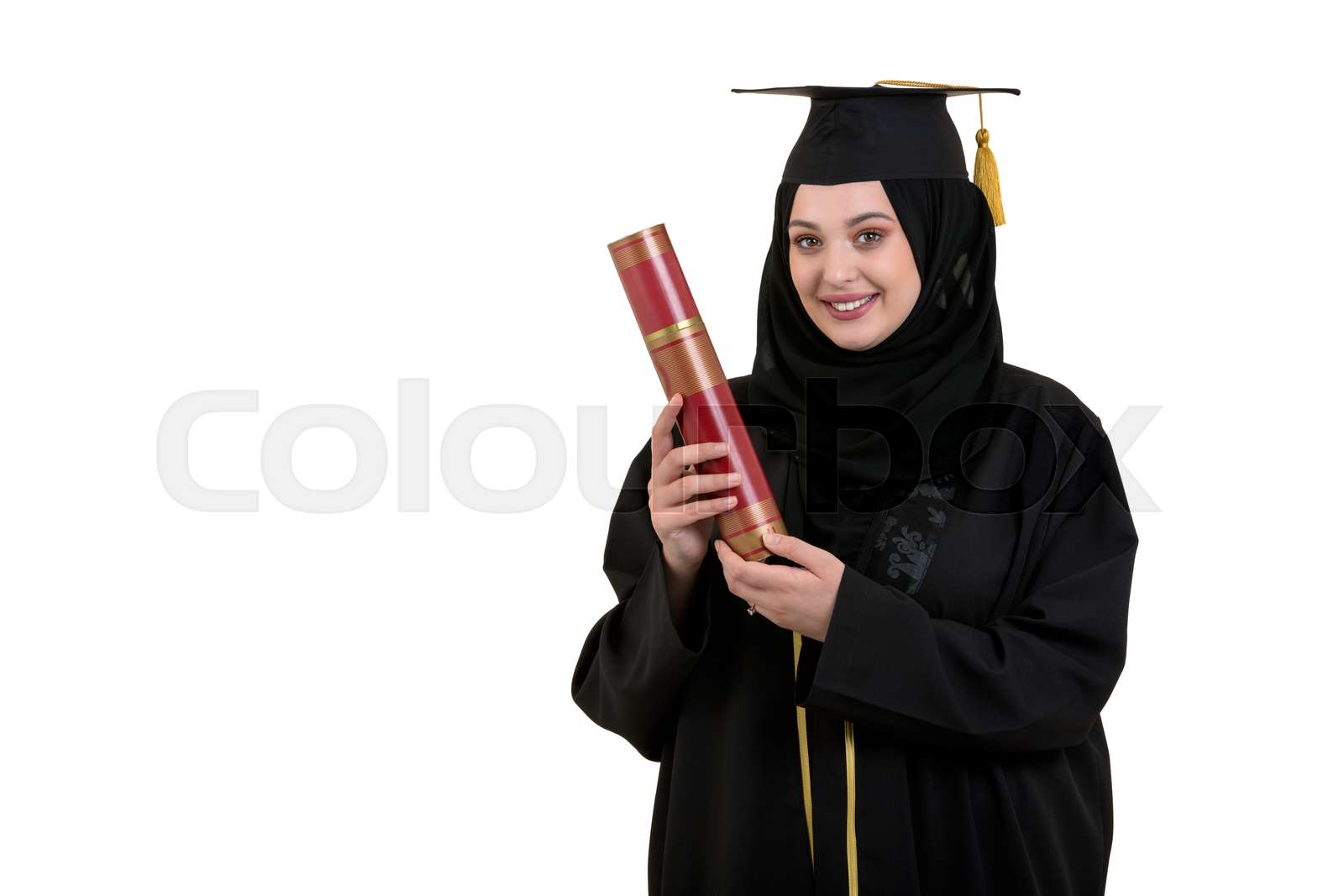 Happy graduate arabic muslim student with diploma | Stock image | Colourbox