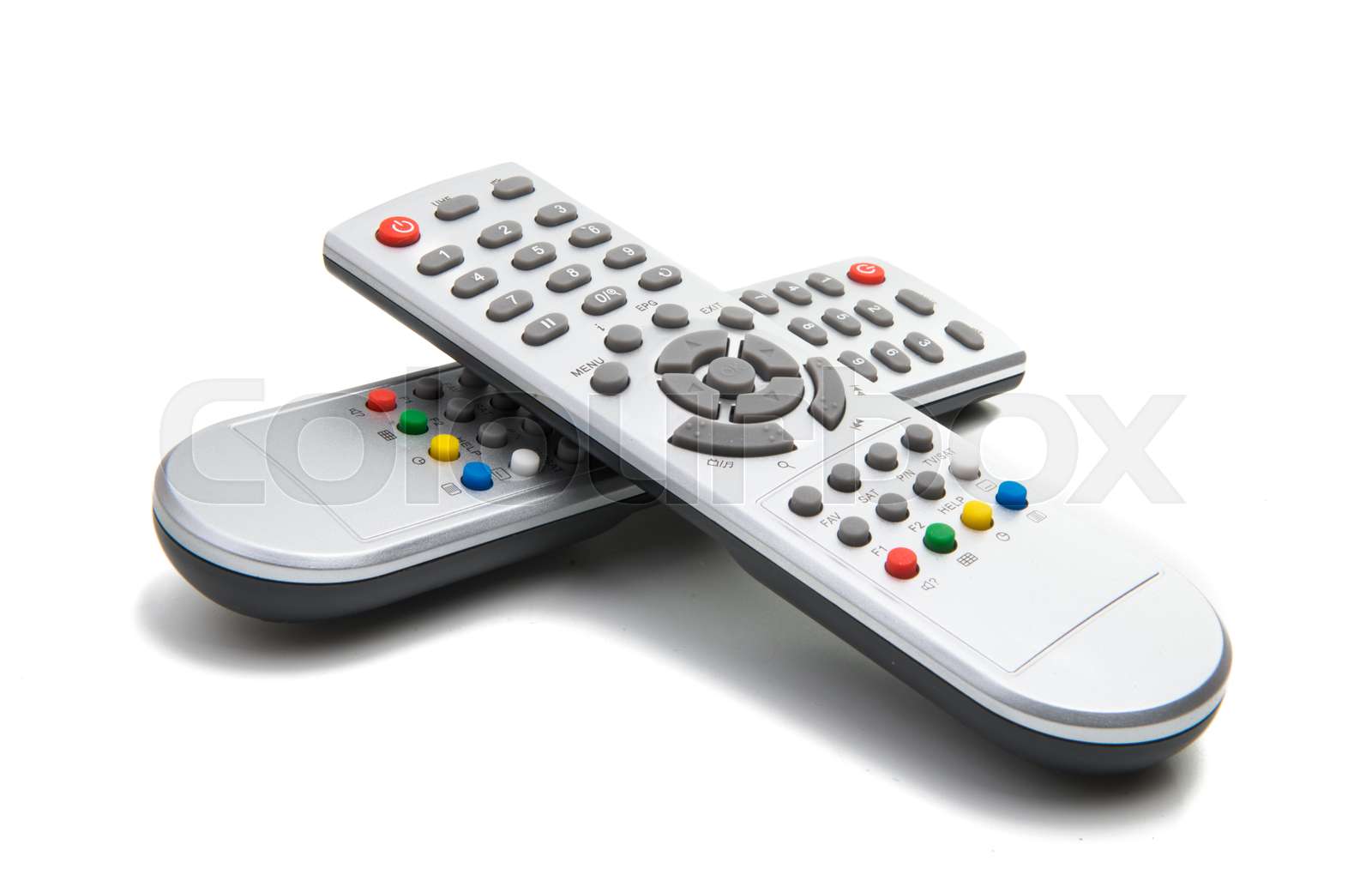 Gray TV remotes isolated | Stock image | Colourbox