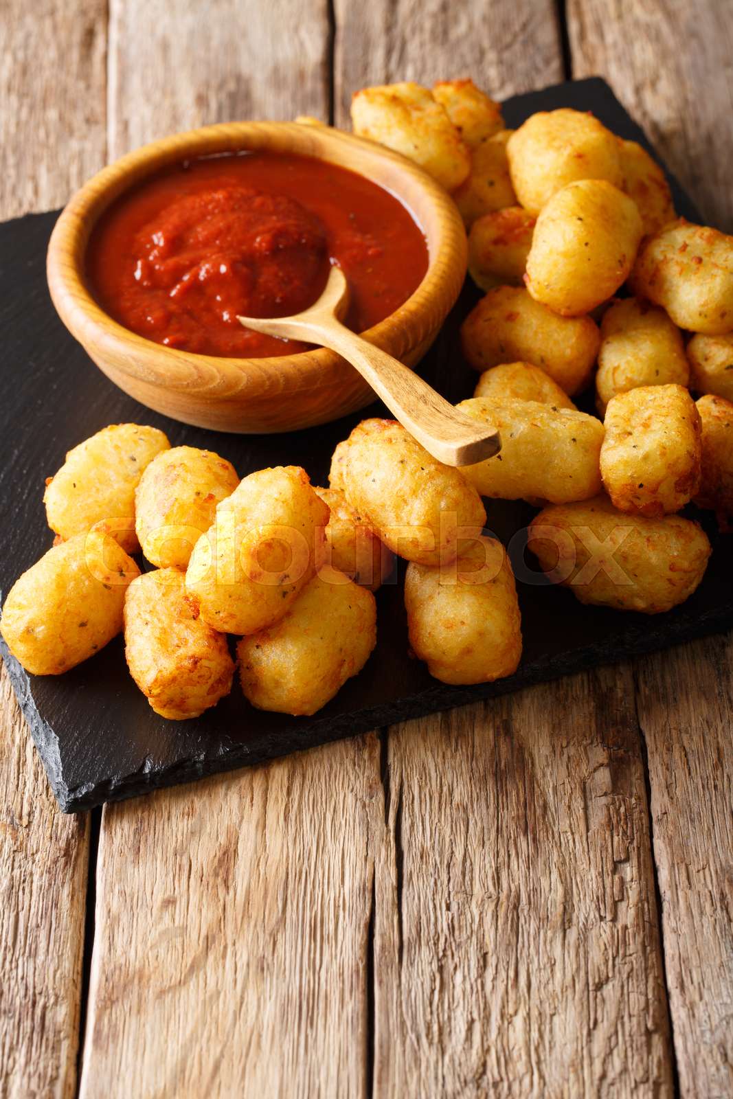 Fried Potato Tater Tots and ketchup close-up. vertical | Stock image ...