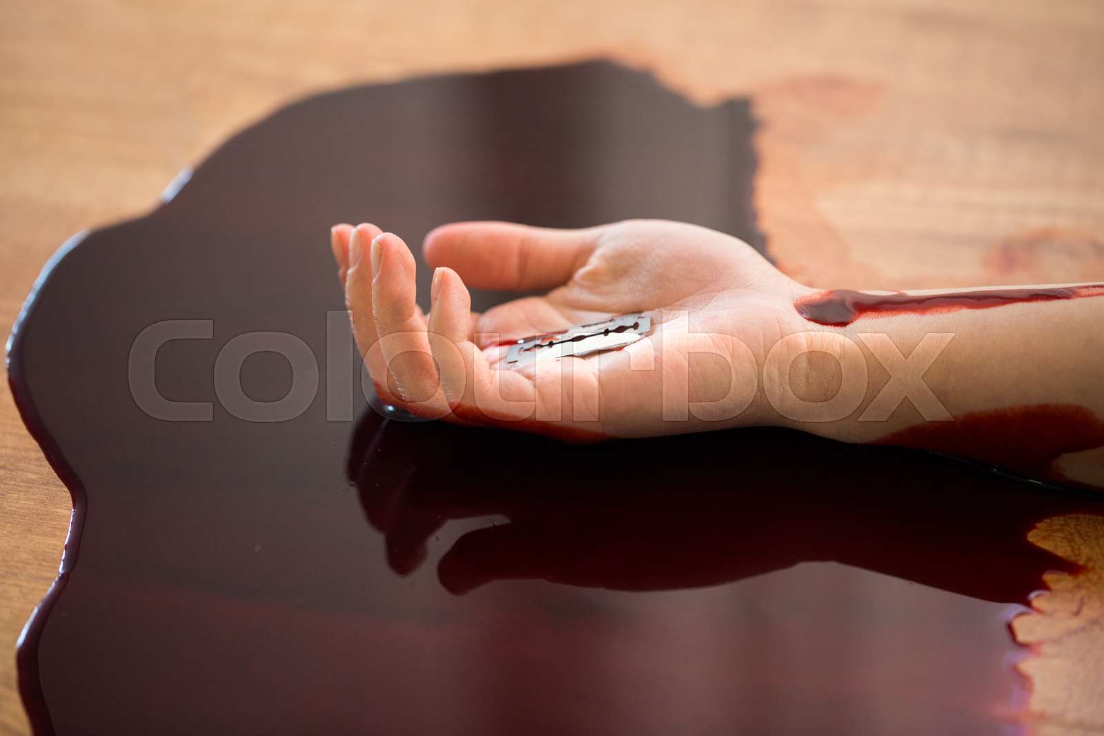 dead woman hand in blood on floor at crime scene | Stock image | Colourbox