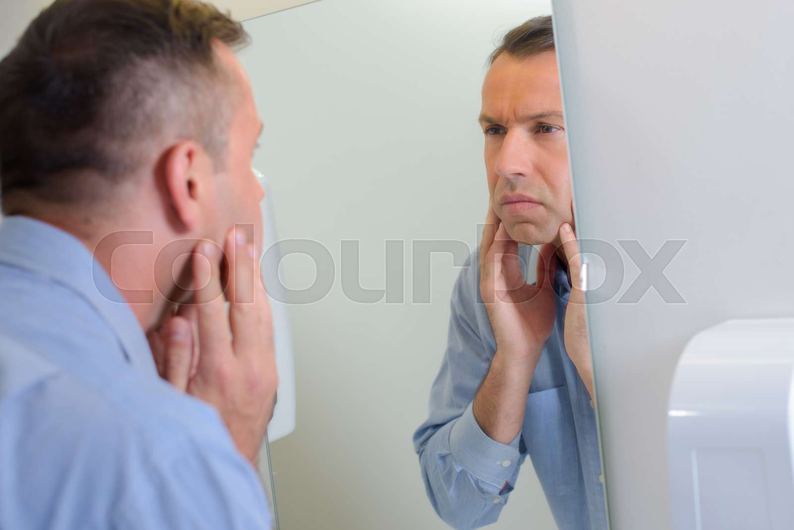 man looking in mirror | Stock image | Colourbox