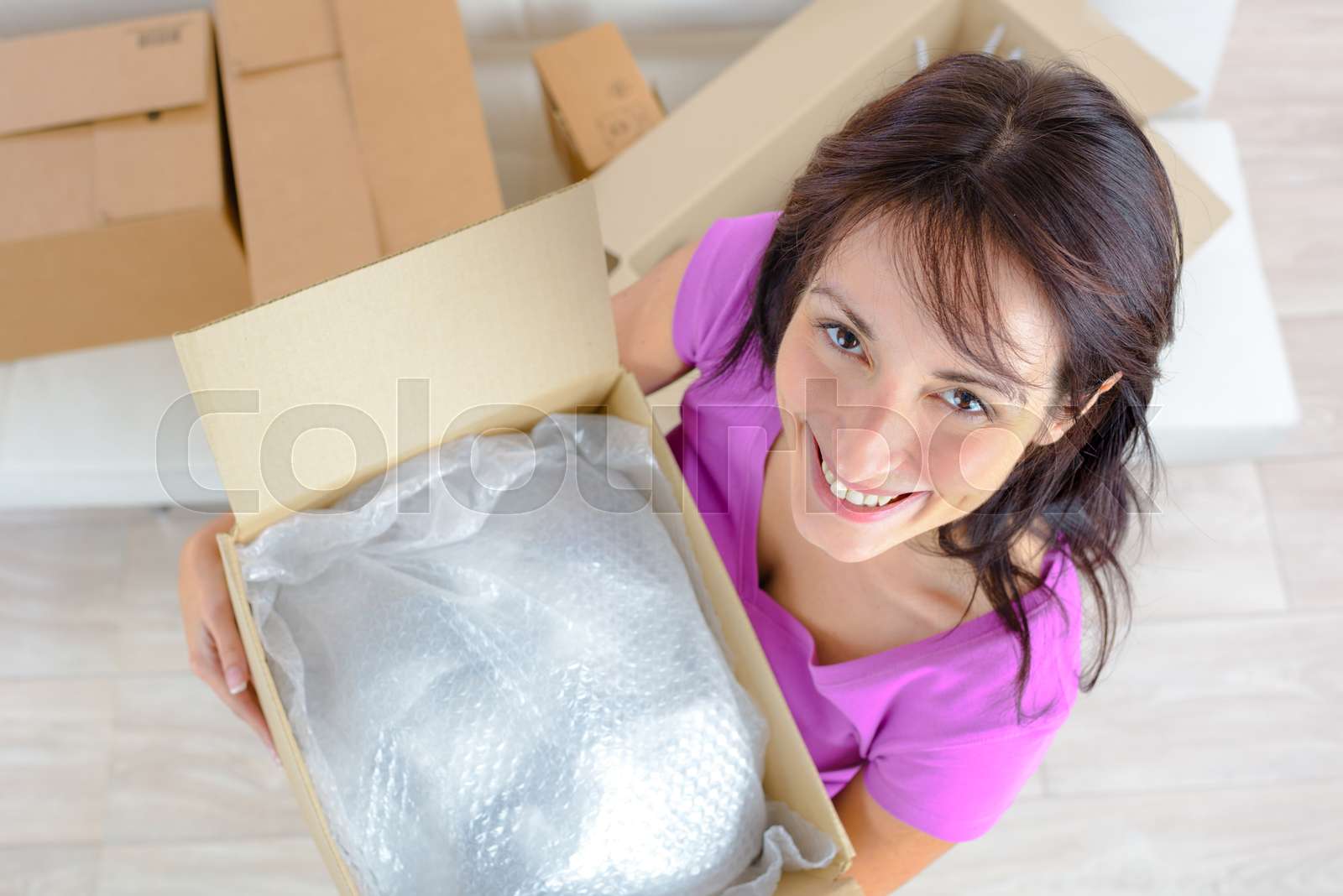 woman carrying box | Stock image | Colourbox