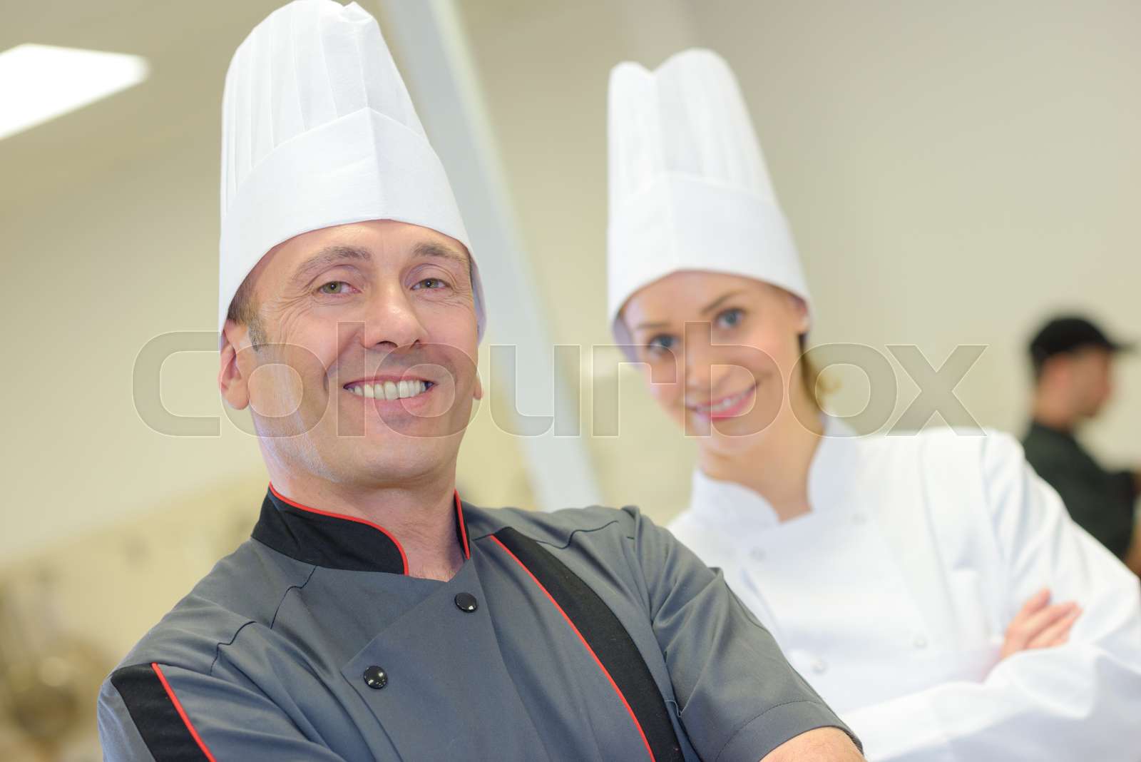 smiling chef and commis chef | Stock image | Colourbox