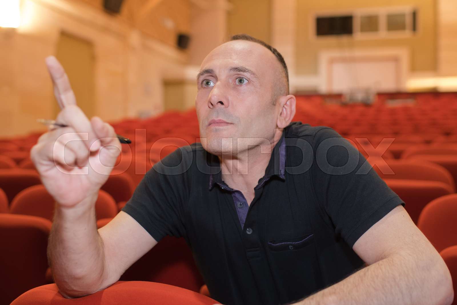 theatre director advising his troupe | Stock image | Colourbox