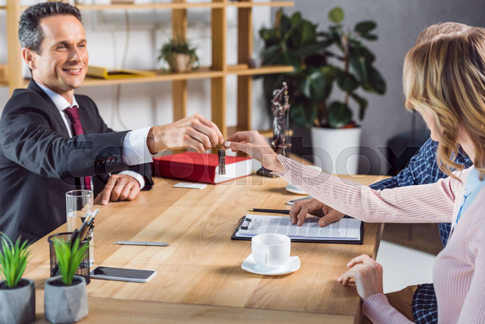 couple getting keys from new home | Stock image | Colourbox