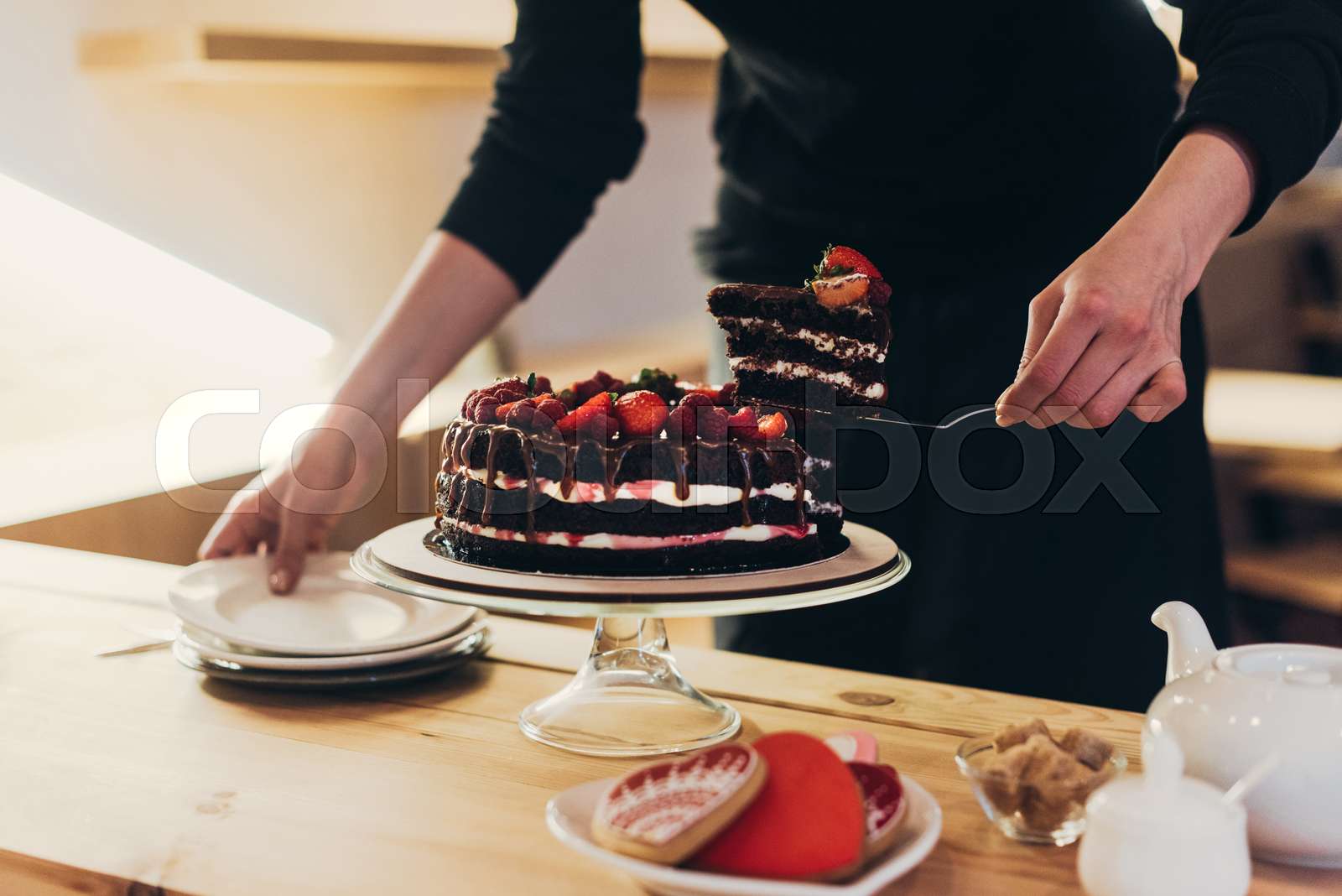 woman taking piece of cake | Stock image | Colourbox