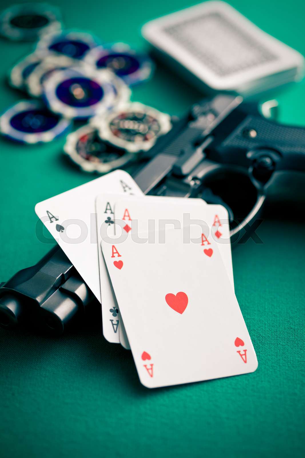 poker cards and handgun | Stock image | Colourbox