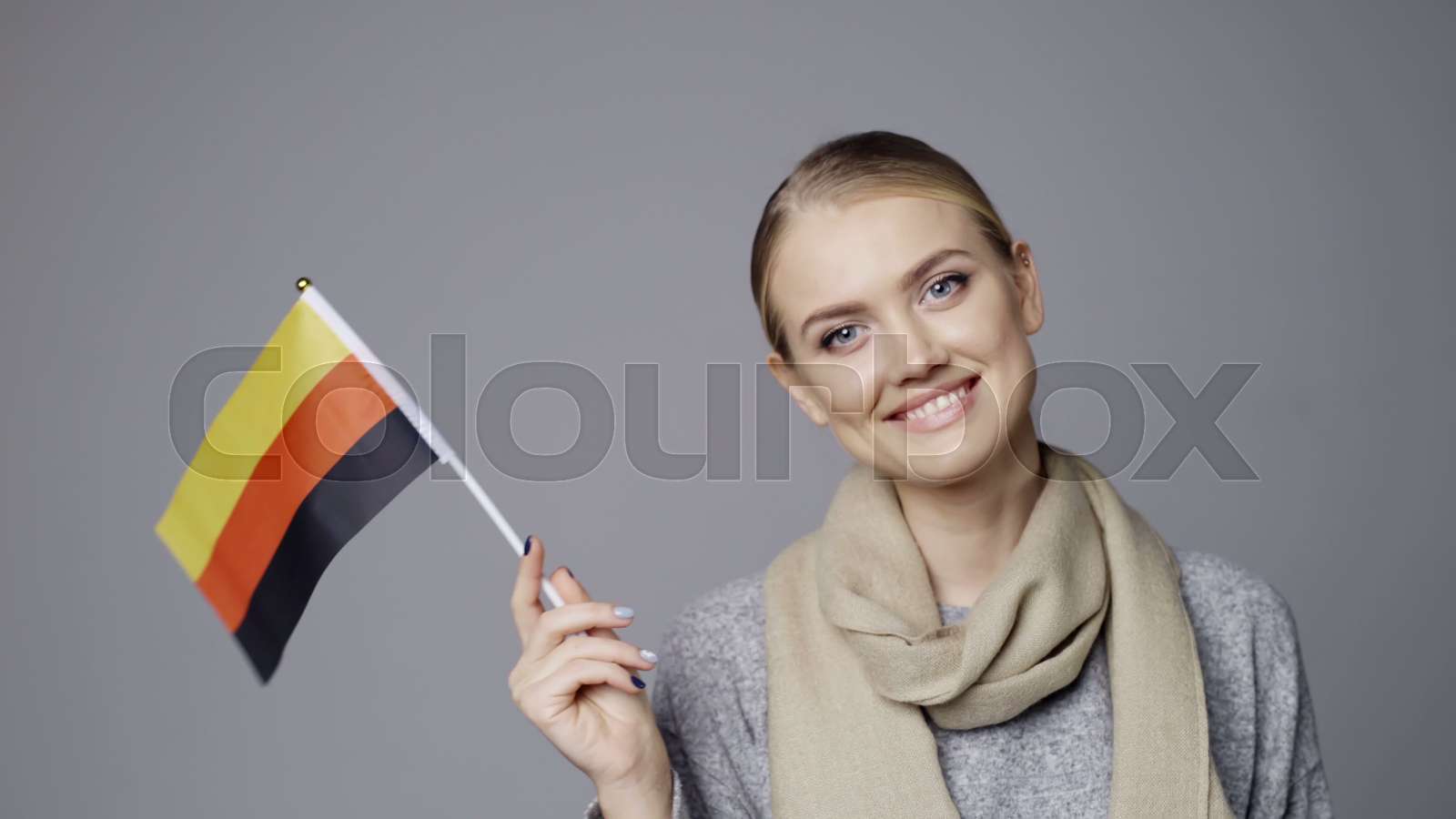 Female holding Germany flag | Stock video | Colourbox