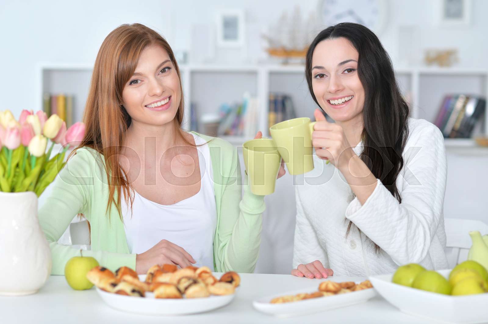 smiling friends drinking tea | Stock image | Colourbox