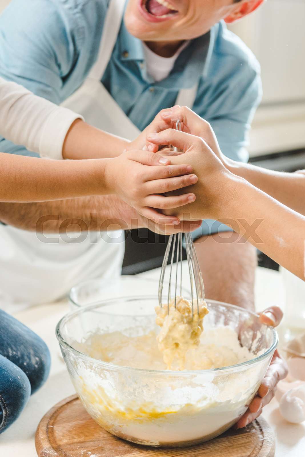 family hands mixing dough | Stock image | Colourbox