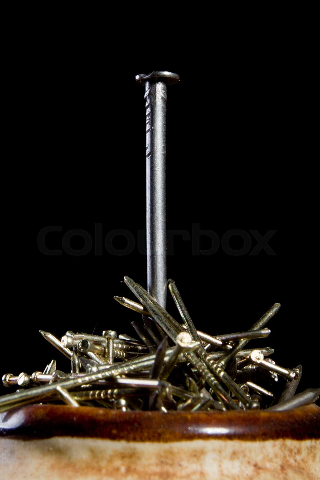 Nail standing vertically | Stock image | Colourbox