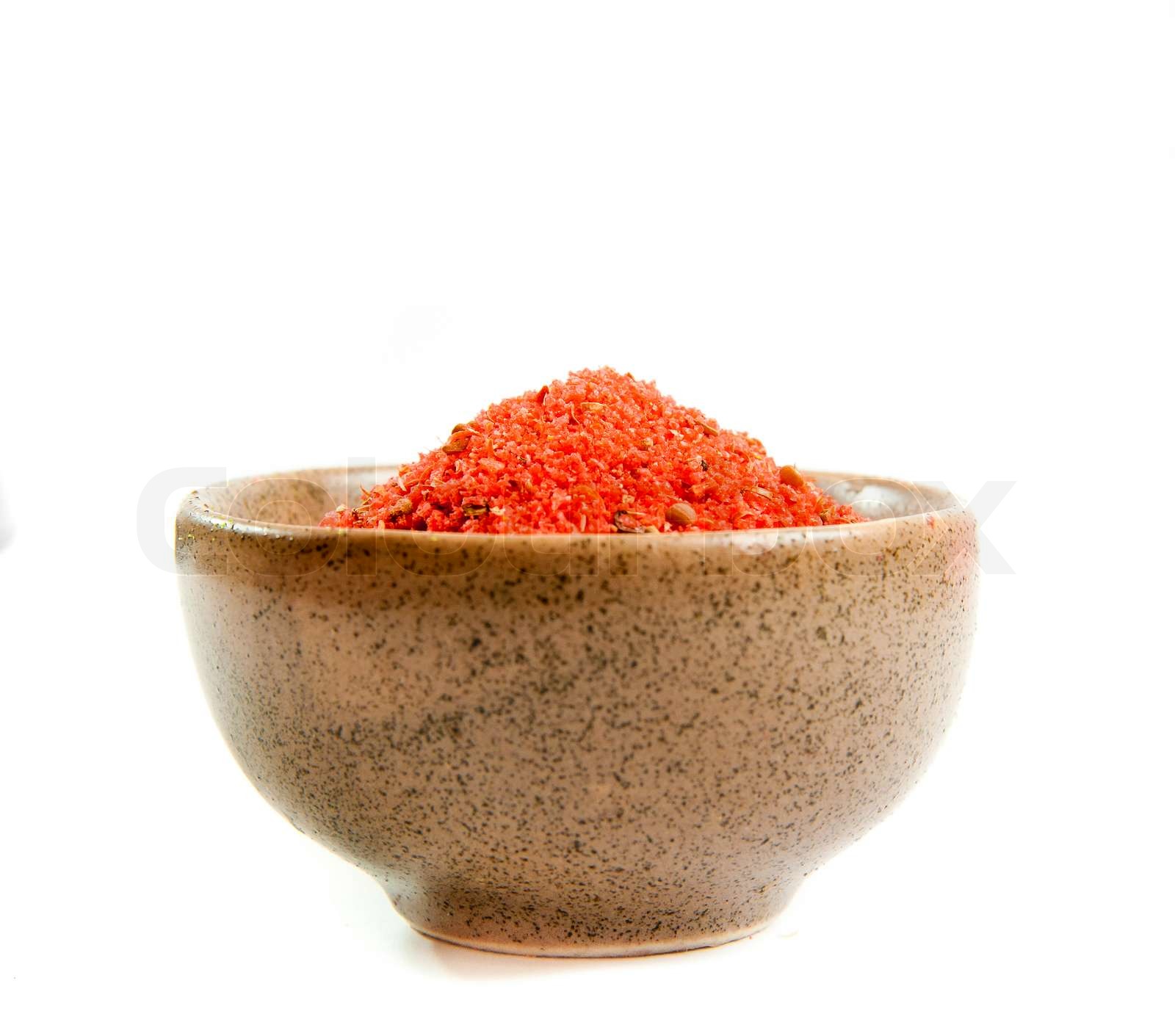 red exotic spices in a ceramic bowl isolated on white | Stock image ...