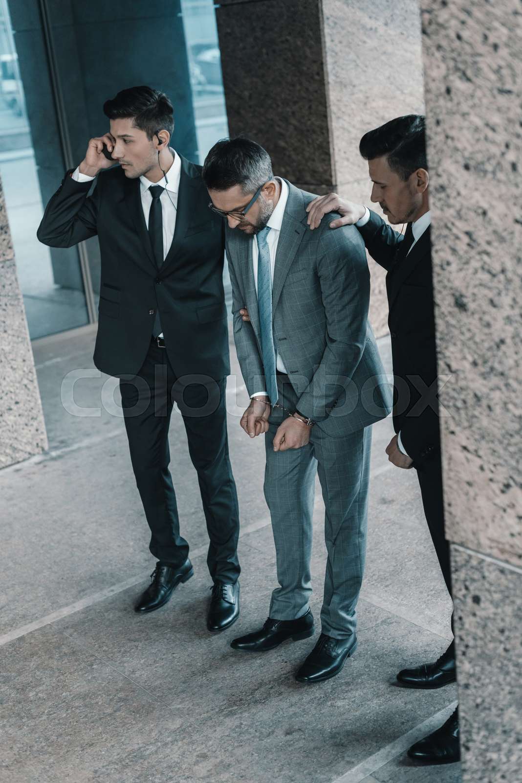 people, handcuffs, security guards | Stock image | Colourbox