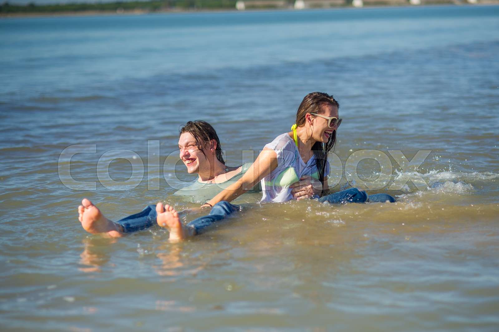 Young couple bathing in the sea. | Stock image | Colourbox