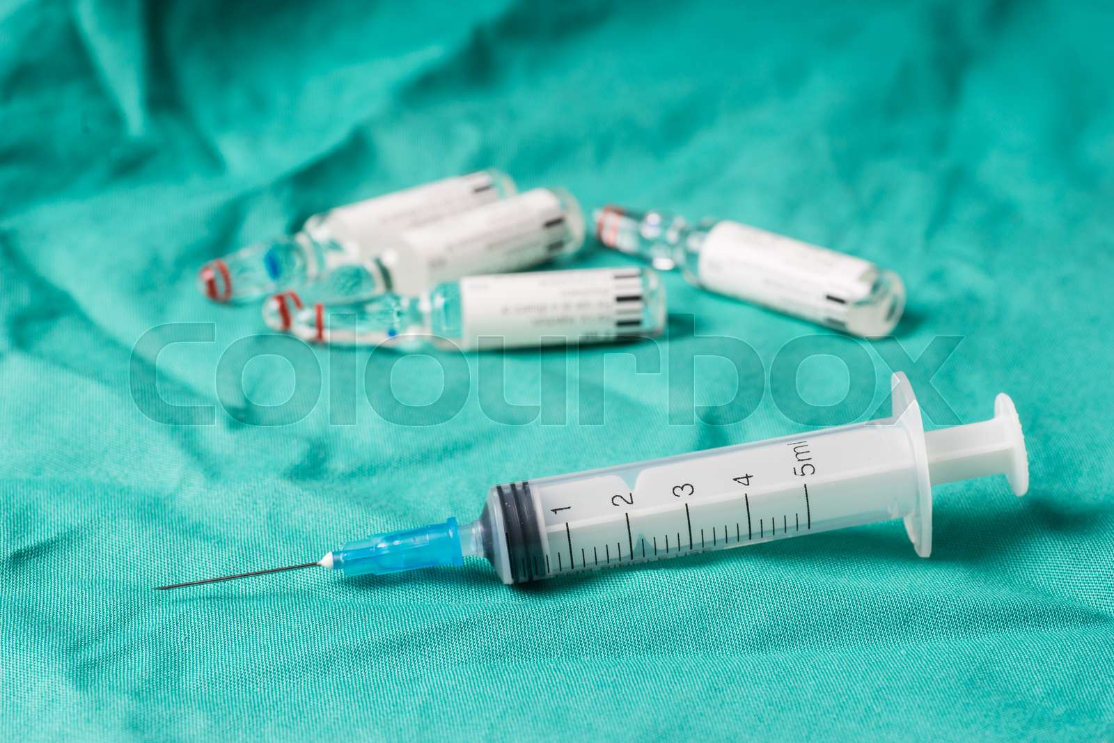 Medical syringe and vials | Stock image | Colourbox