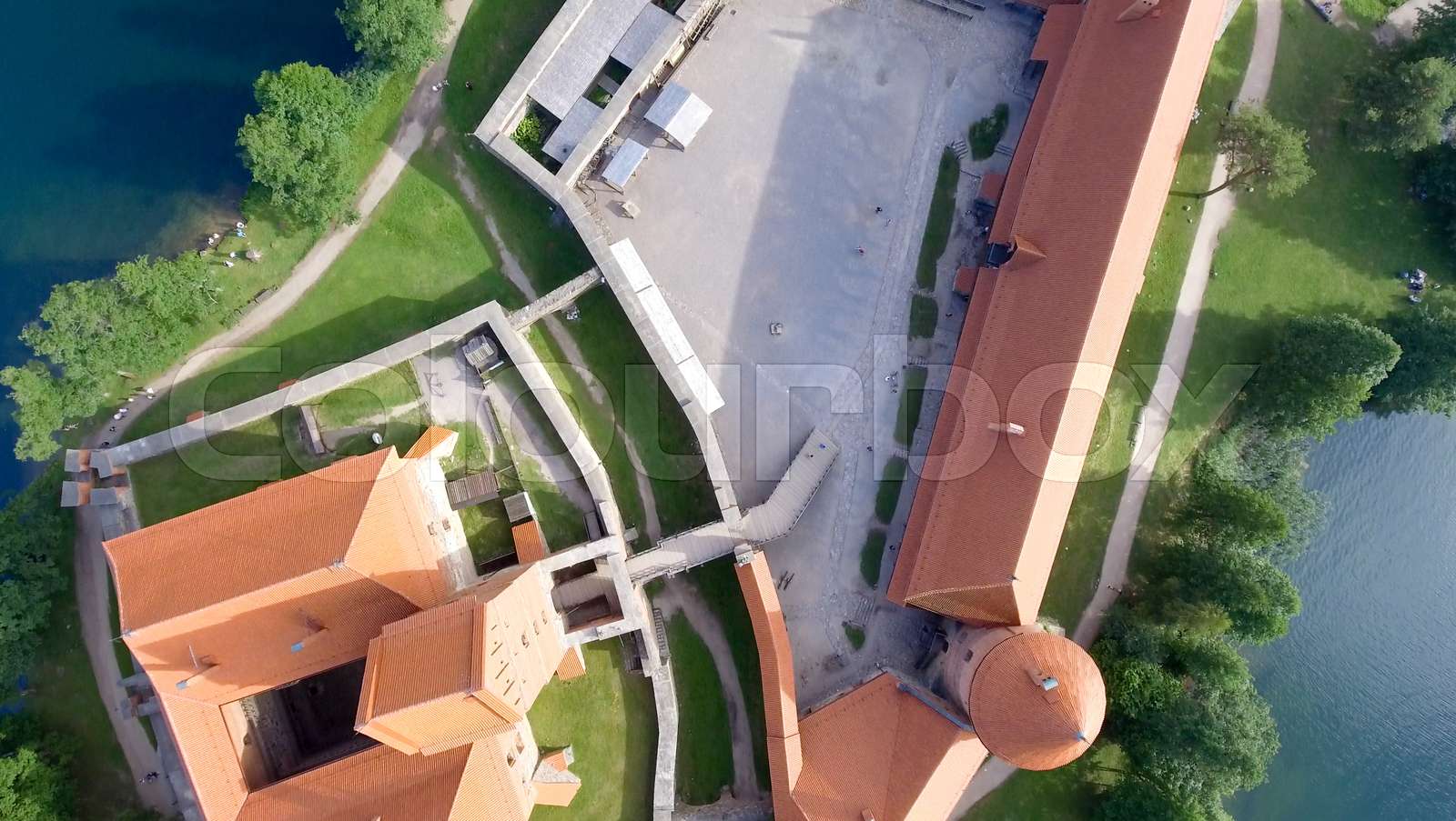 Overhead aerial view of ancient castle surrounded by water | Stock ...