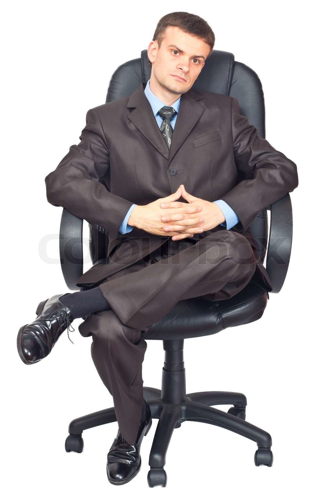 Portrait of young businessmen sitting on chair isolated against white ...