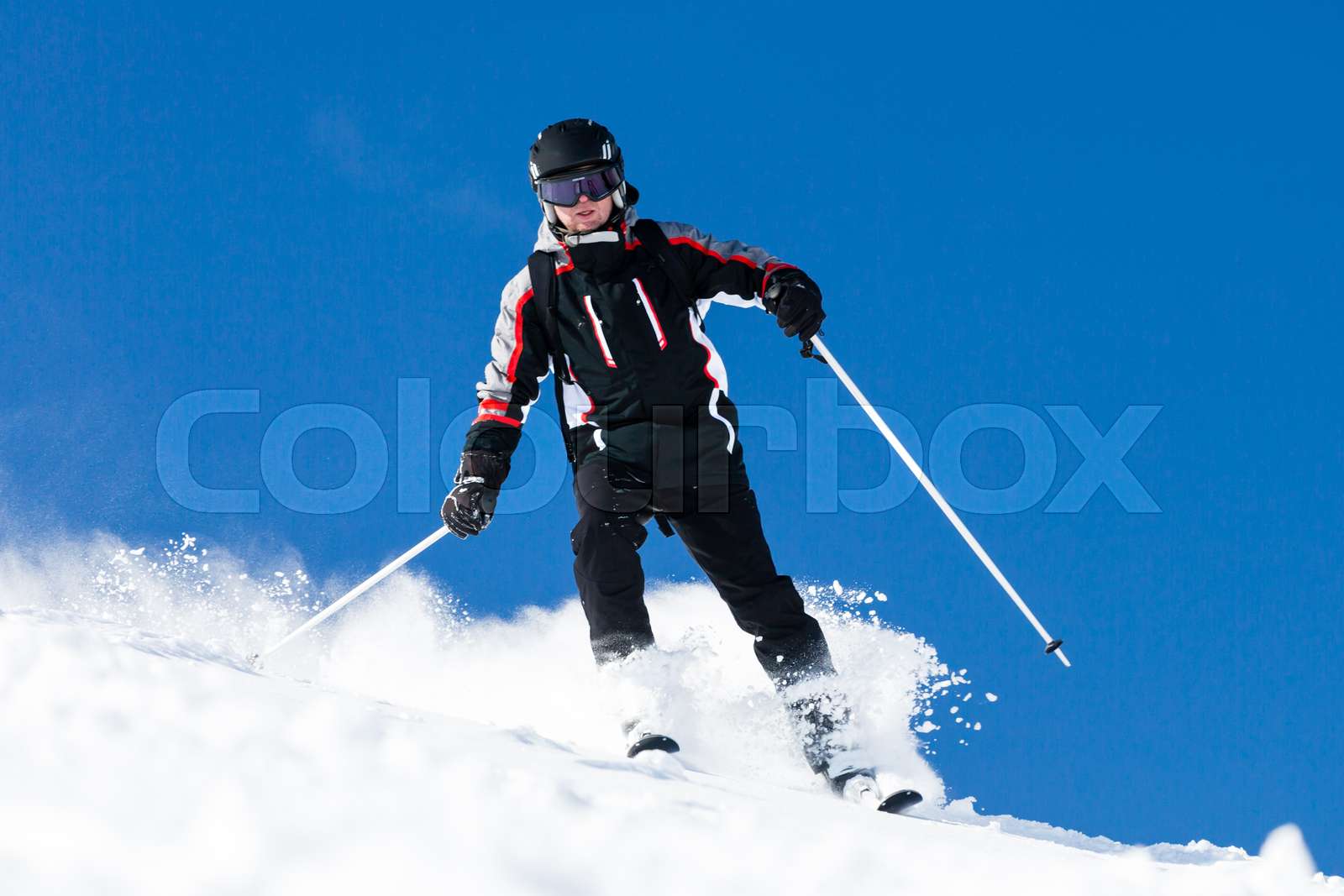 Male skier skiing at ski resort | Stock image | Colourbox