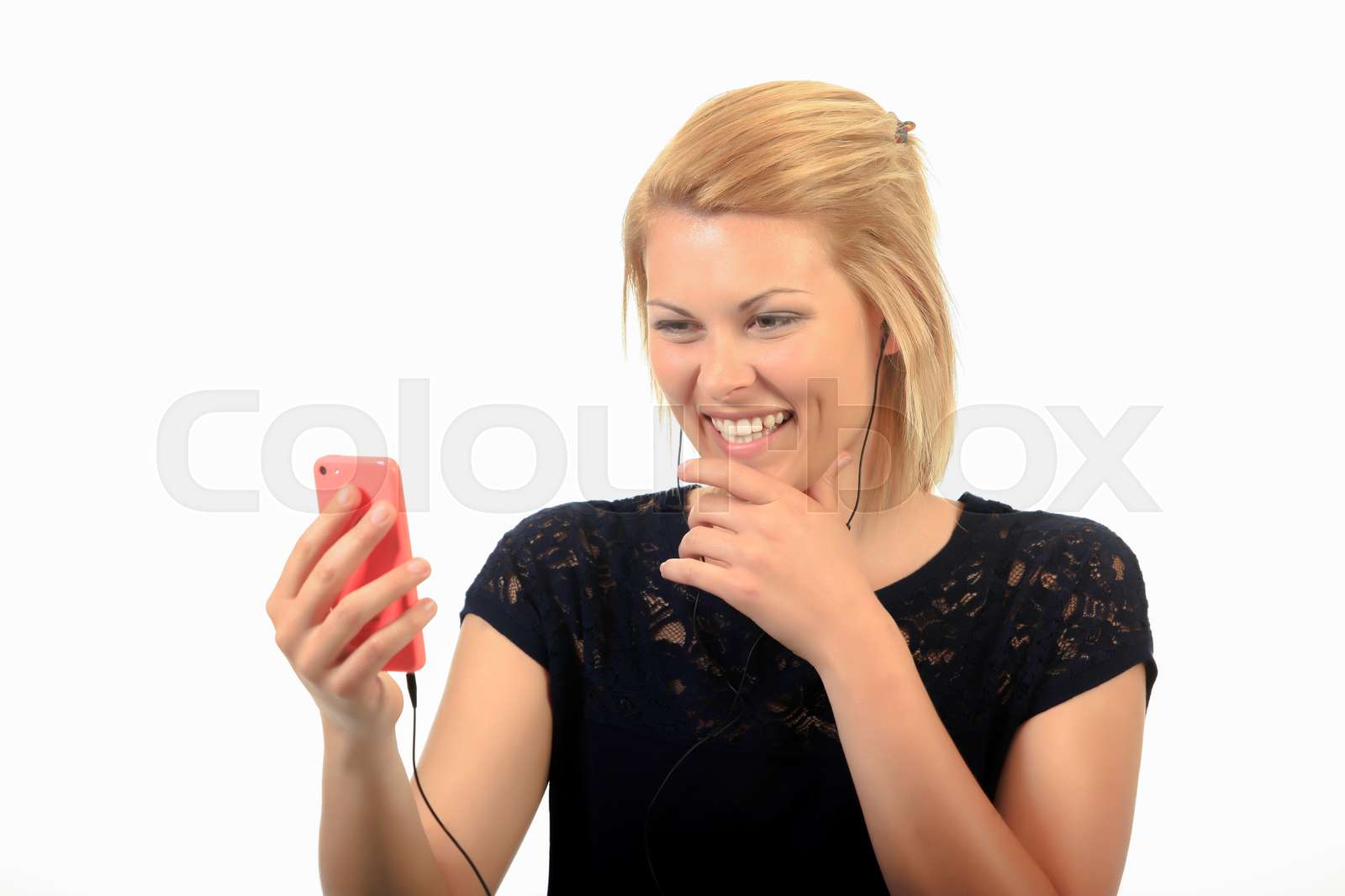 Laughing at a text message | Stock image | Colourbox