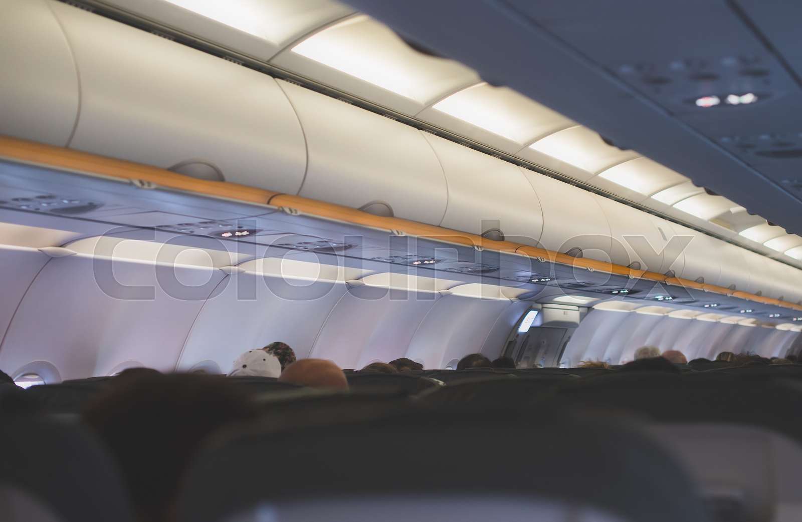 Interior inside of the plane with passengers. | Stock image | Colourbox