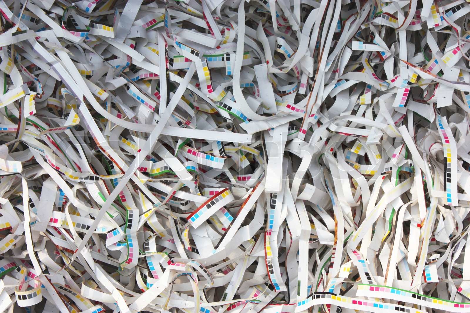 Waste of the polygraphic industry, the thin strips of the cut off paper ...