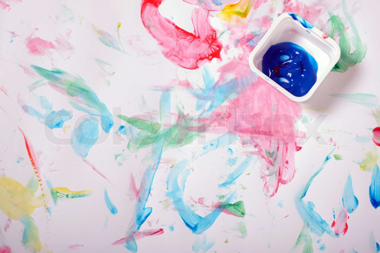 Painted messy fingerprints over white paper | Stock image | Colourbox
