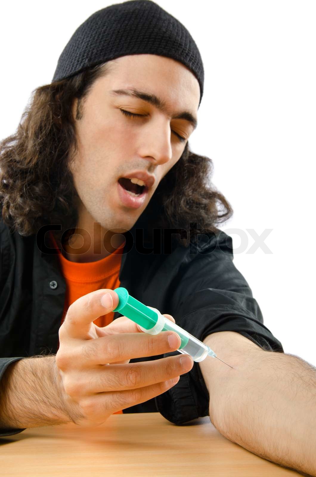 Drug addict during injection | Stock image | Colourbox