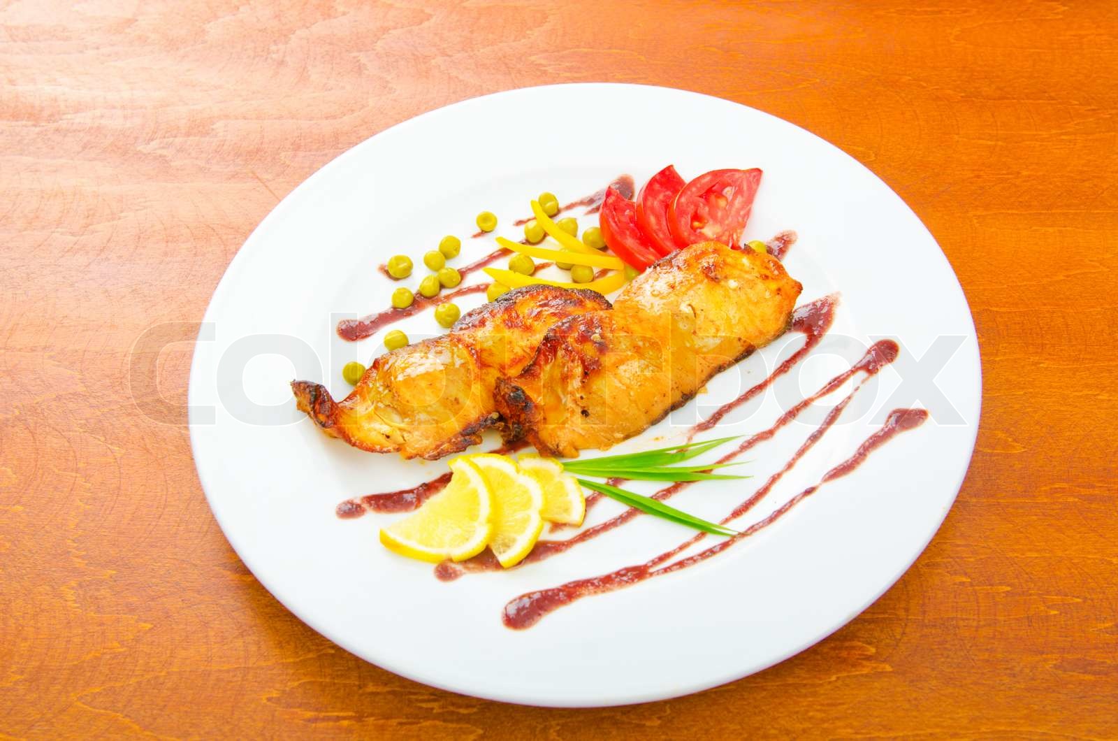 Fish fried and served in the plate | Stock image | Colourbox