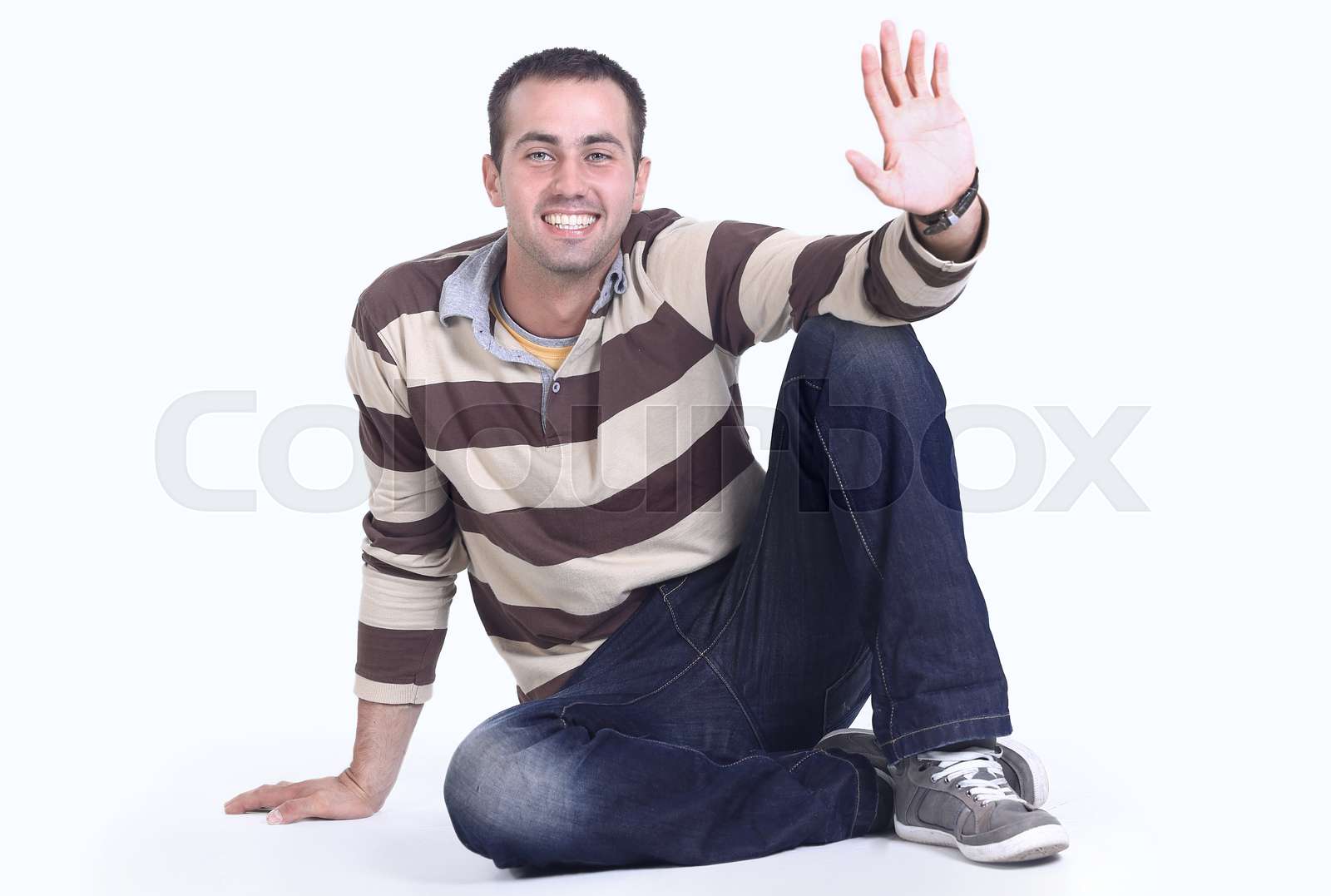 modern young man sitting on the floor | Stock image | Colourbox