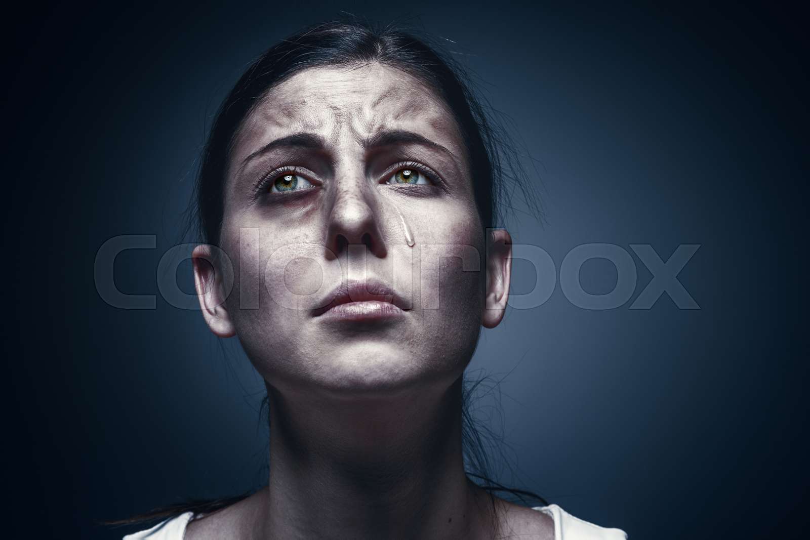 Close up portrait of a crying woman with bruised skin and black eyes ... Close up portrait of a crying woman with bruised skin and black eyes ...
