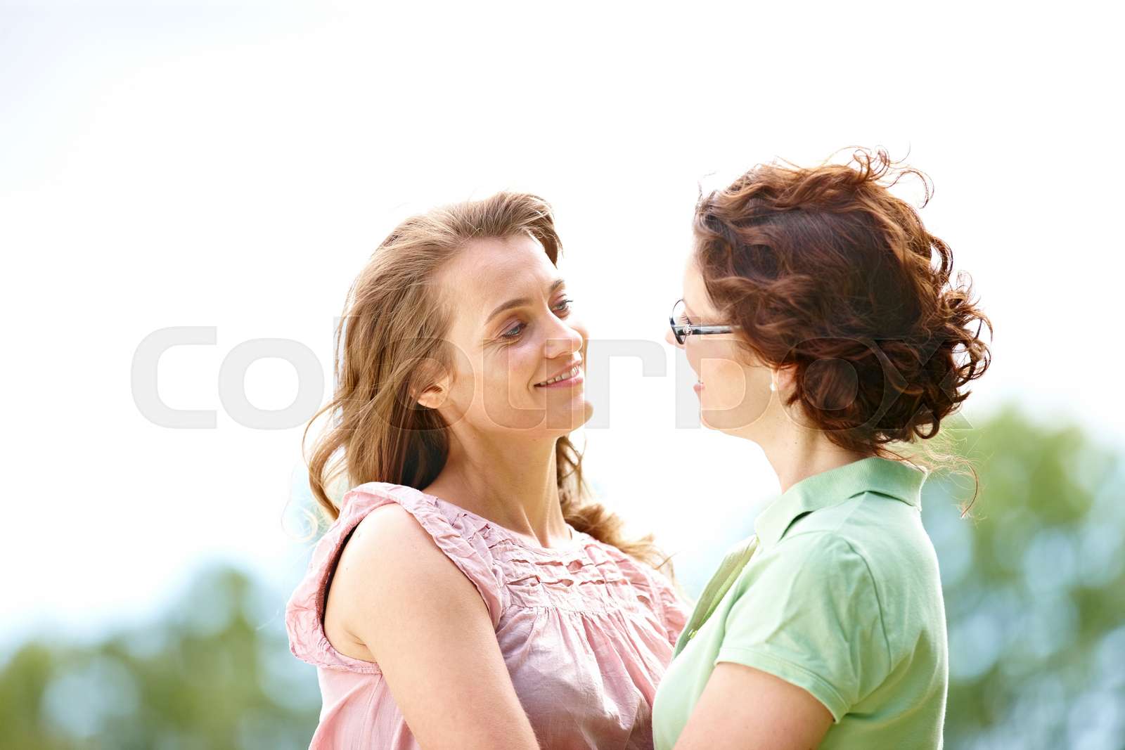Two women in loving embrace | Stock image | Colourbox