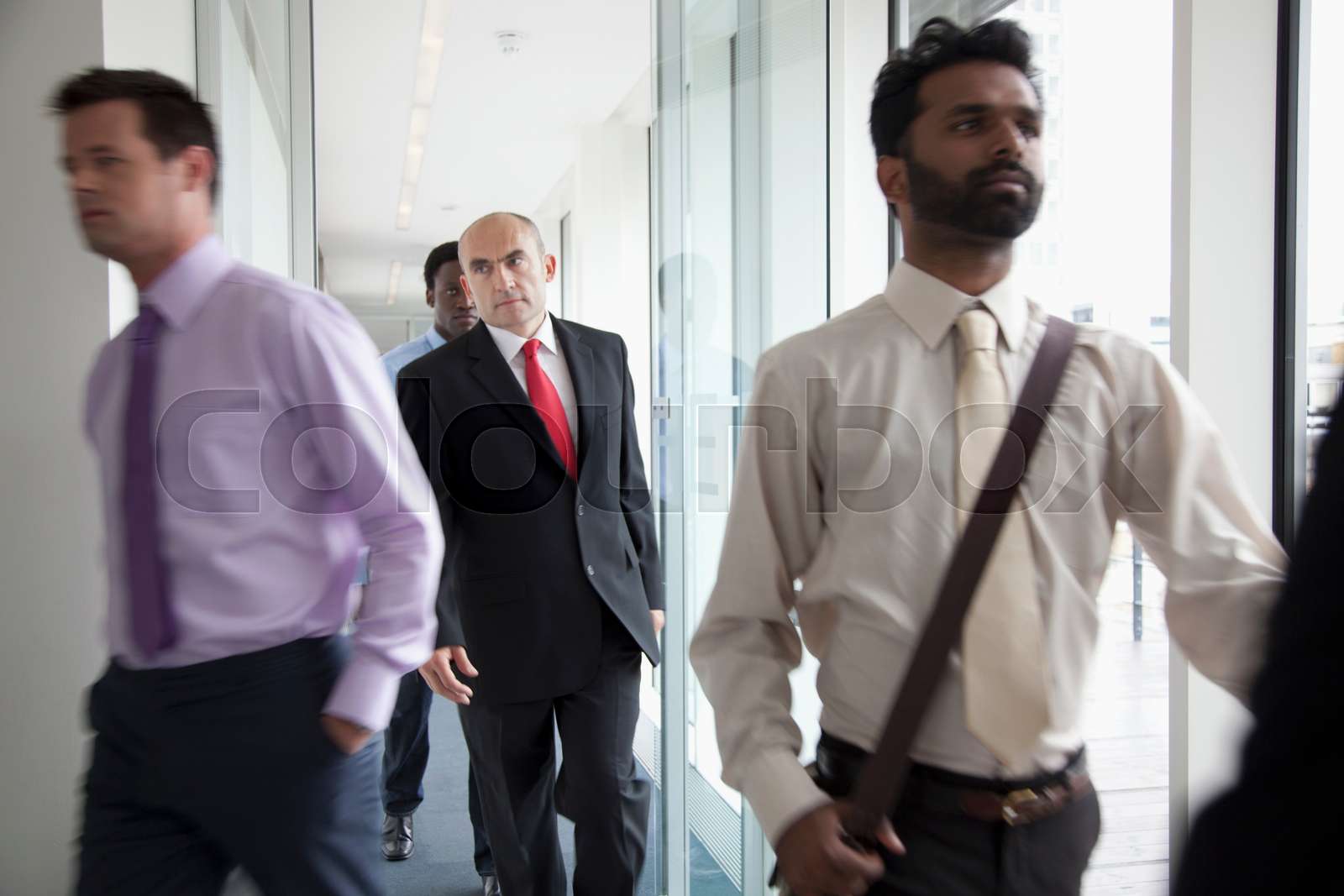 Business people walking fast past camera | Stock image | Colourbox