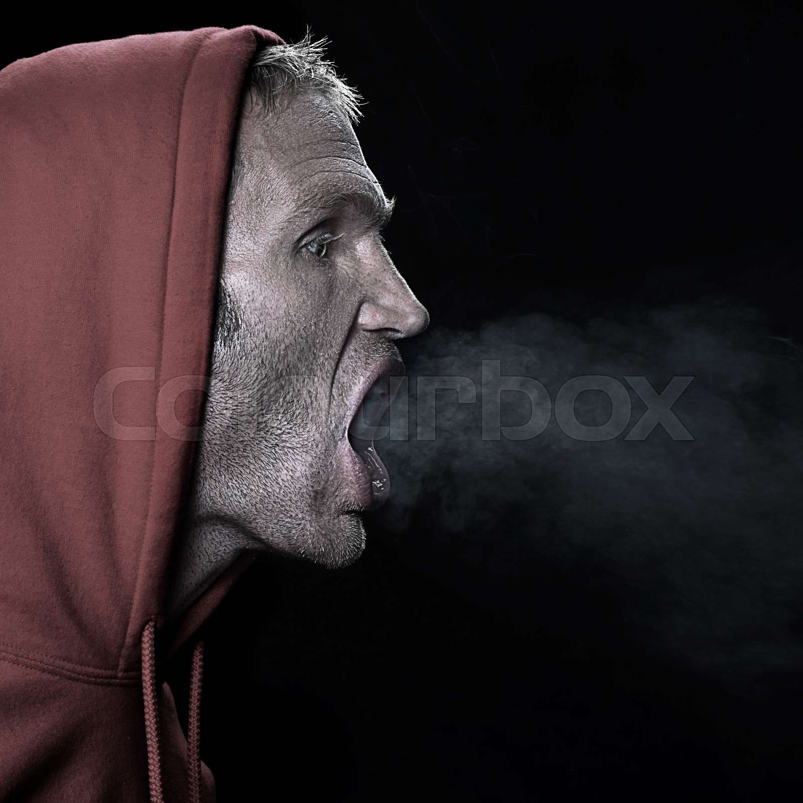 Man breathing out | Stock image | Colourbox