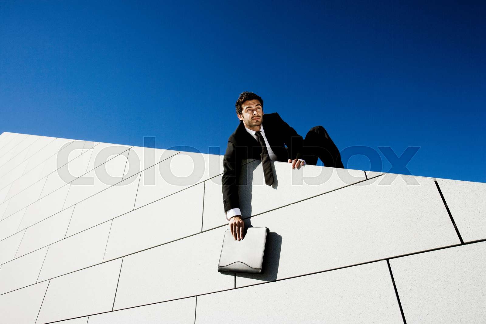 Man on wall | Stock image | Colourbox