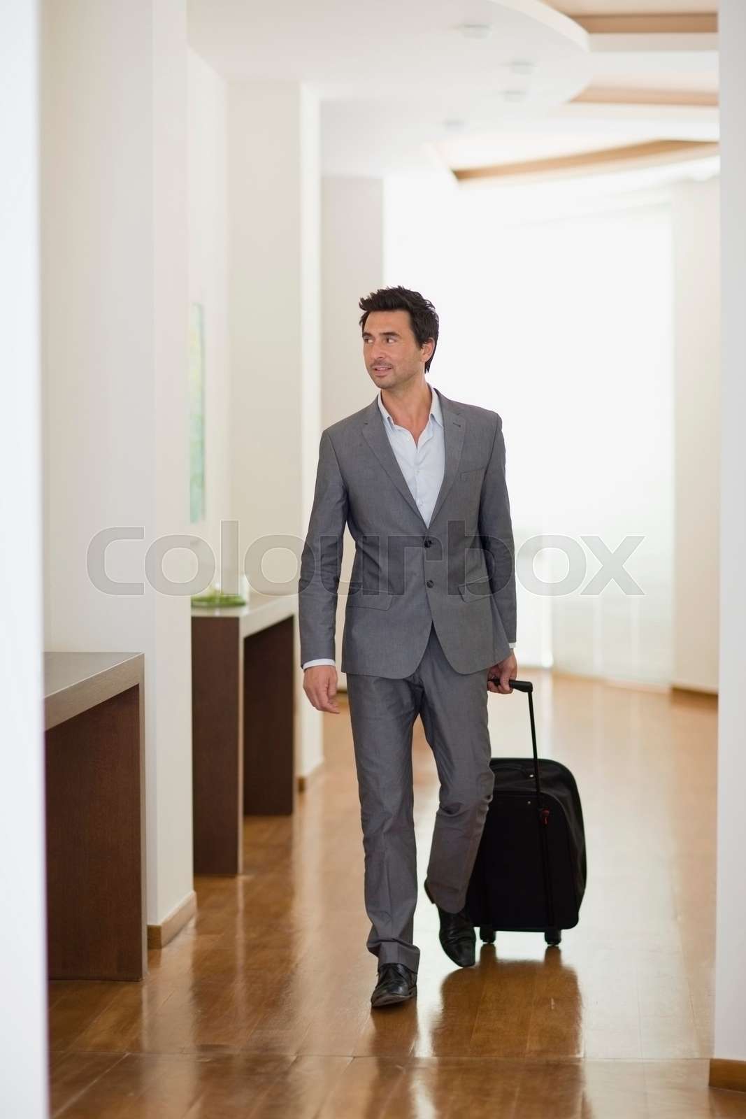 Man walking through hotel | Stock image | Colourbox