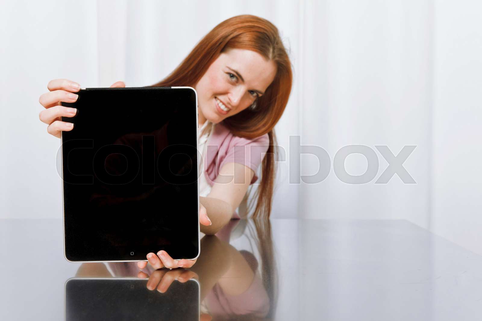Young woman using new technology | Stock image | Colourbox