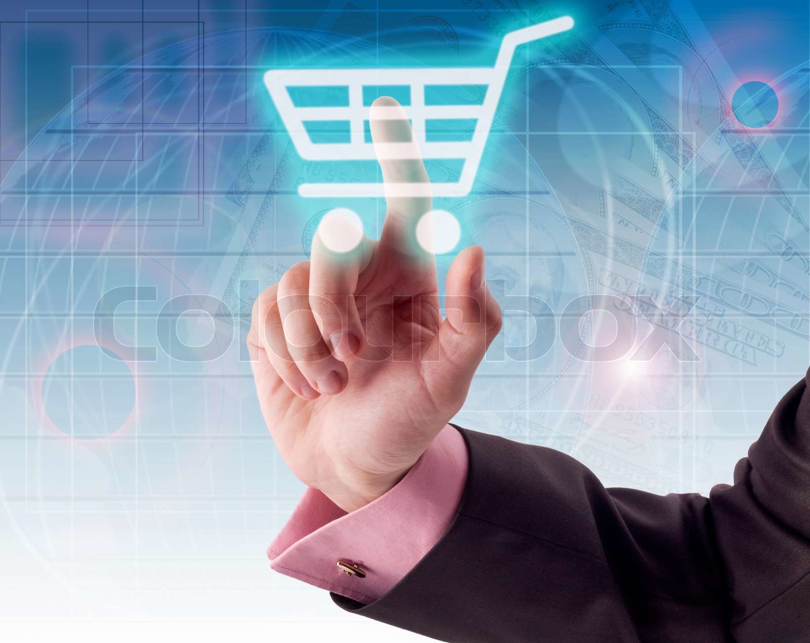 Man hand pressing shopping cart icon | Stock image | Colourbox